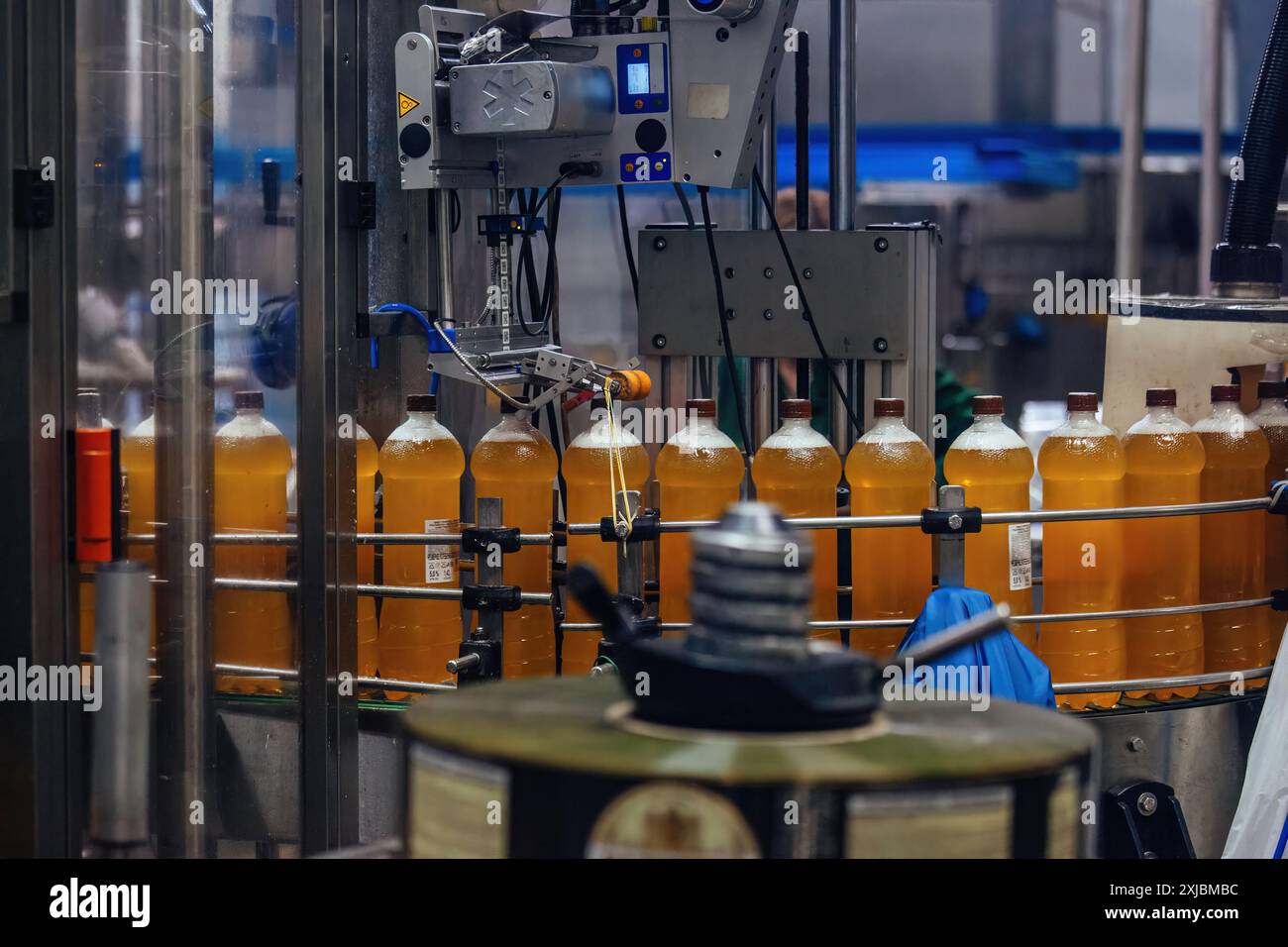 Production line of bottling of beverage into plastic bottles Stock ...
