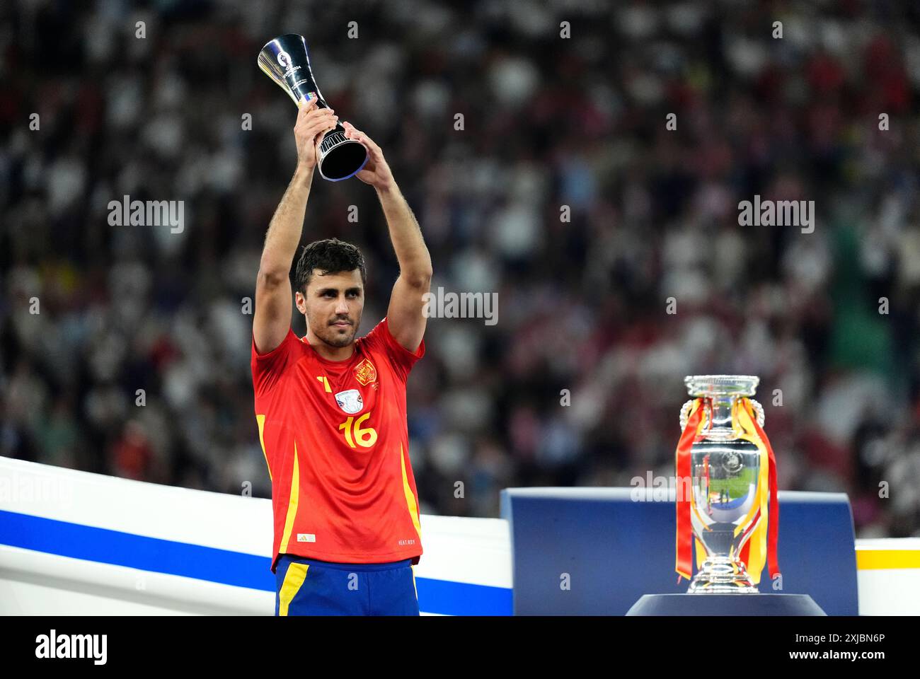 Spain's Rodri with the Player of the Tournament trophy after winning ...