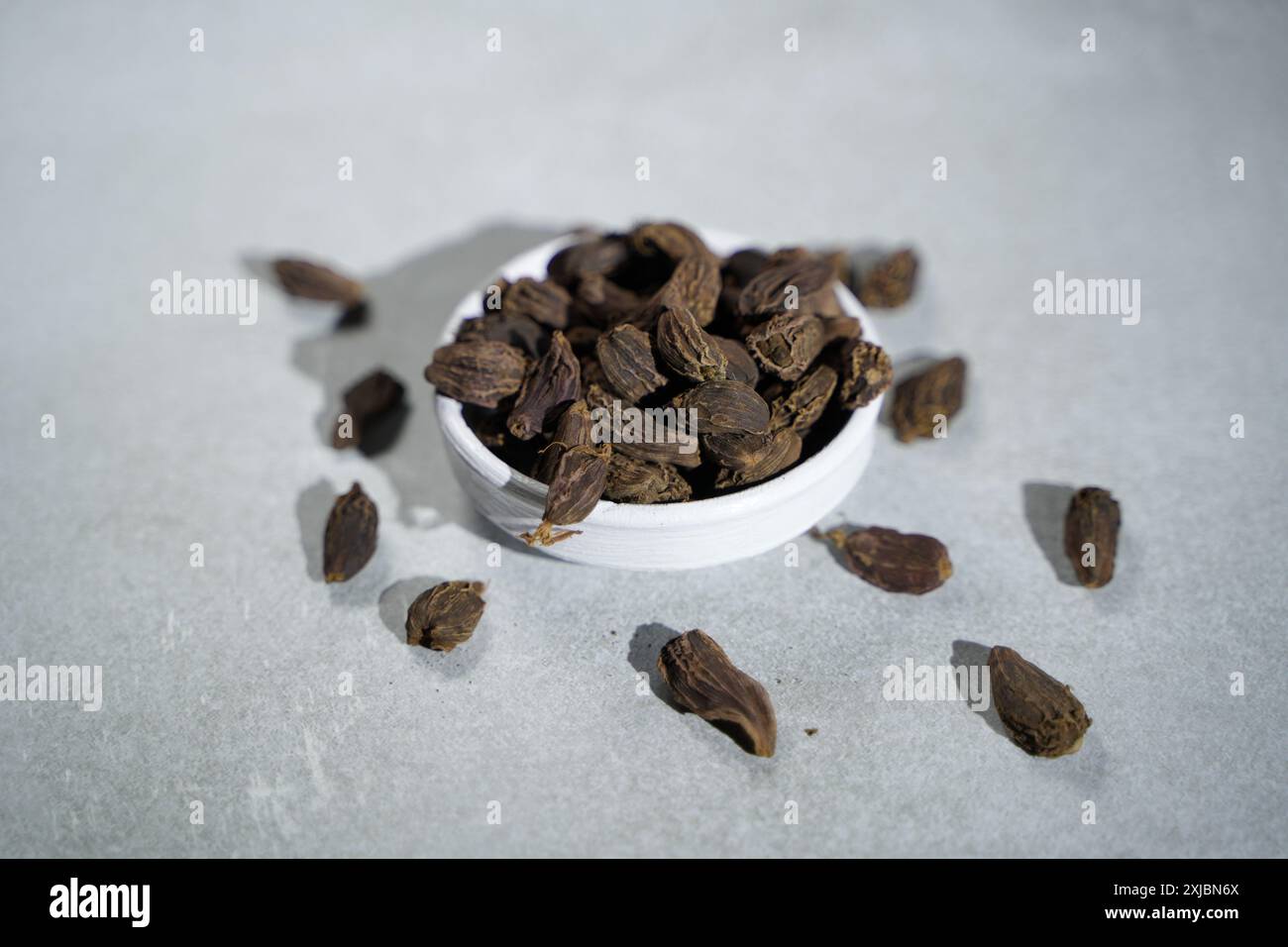 Black Cardamom - Kali Ilayachi - Badi Elaichi is placed on bowl Stock ...