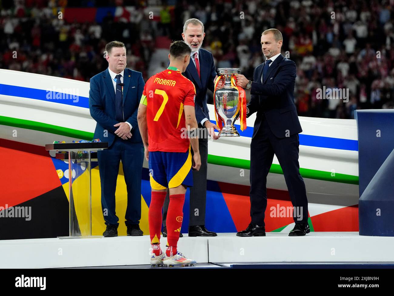 Spain's Alvaro Morata is handed the trophy by UEFA President Aleksander ...