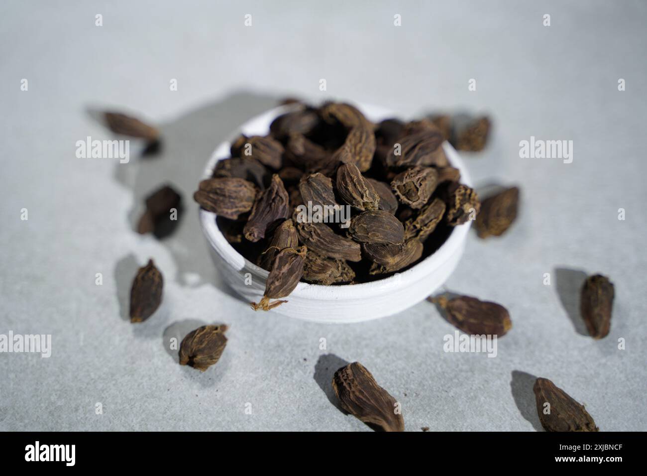 Black Cardamom - Kali Ilayachi - Badi Elaichi is placed on bowl Stock ...
