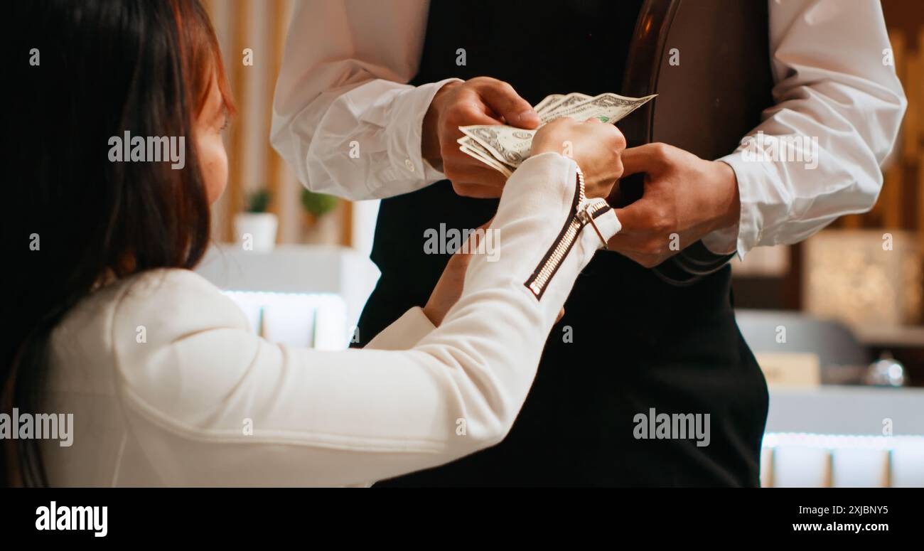 Tipping waiter holiday hi-res stock photography and images - Alamy