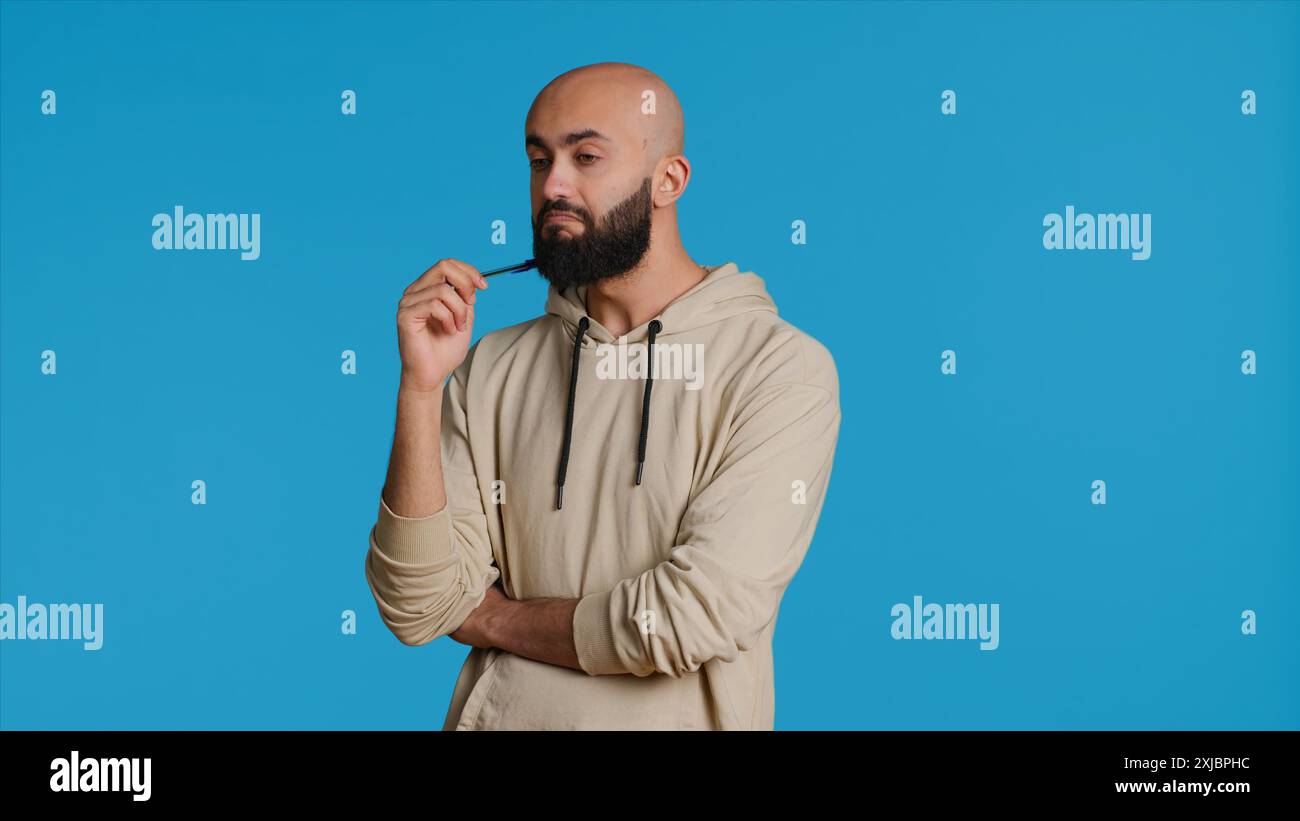 Arab person thinking about solution to the problem, acting pensive and ...