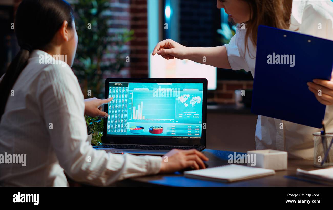 Manager and company financial advisor analyzing statistical graphs, zoom in shot on laptop ...