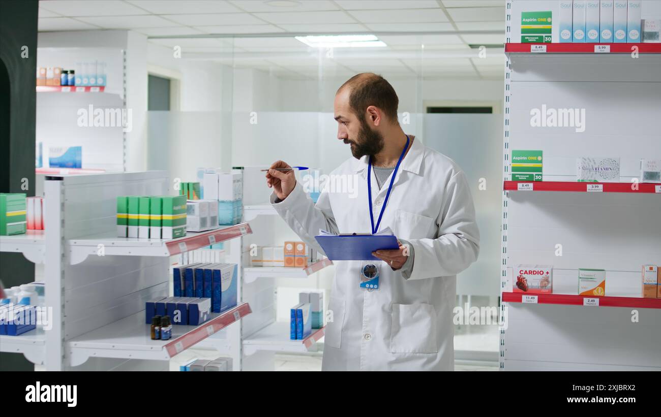 Druggist counting all pharmaceutical stock in pharmacy shop, working on ...