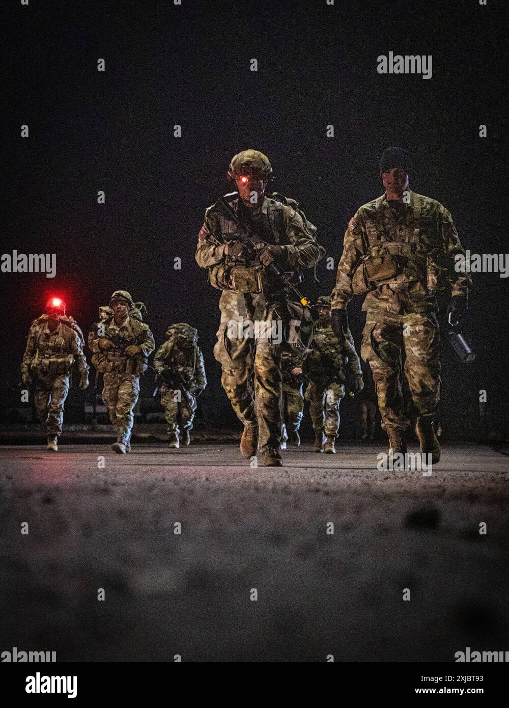 U.S. Army Soldiers from the 4th Infantry Division, trek their 12 mile ...