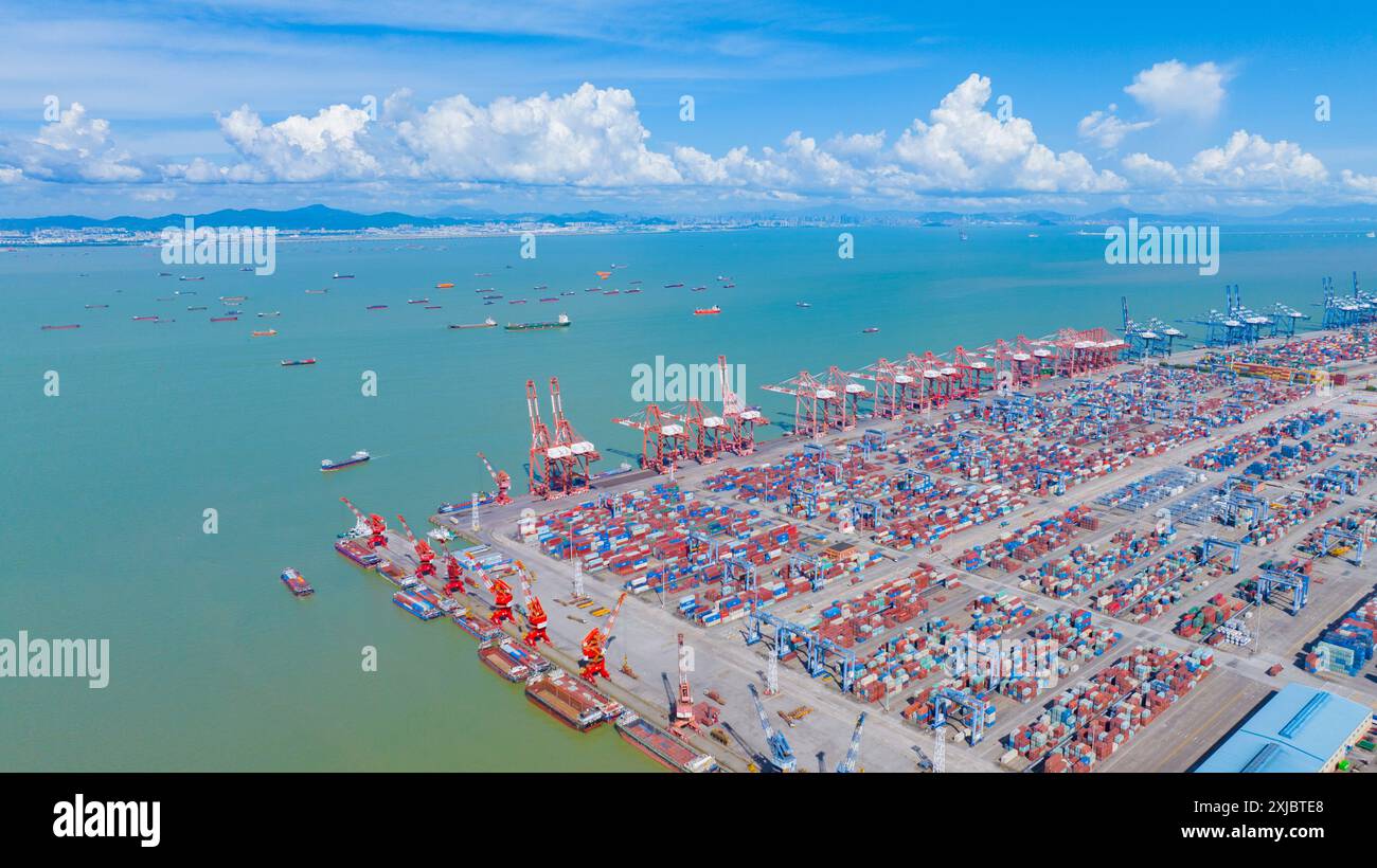 GUANGZHOU, CHINA - JULY 13, 2024 - Cargo ships load and unload cargo at ...