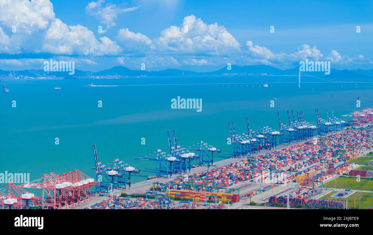 GUANGZHOU, CHINA - JULY 13, 2024 - Cargo ships load and unload cargo at ...