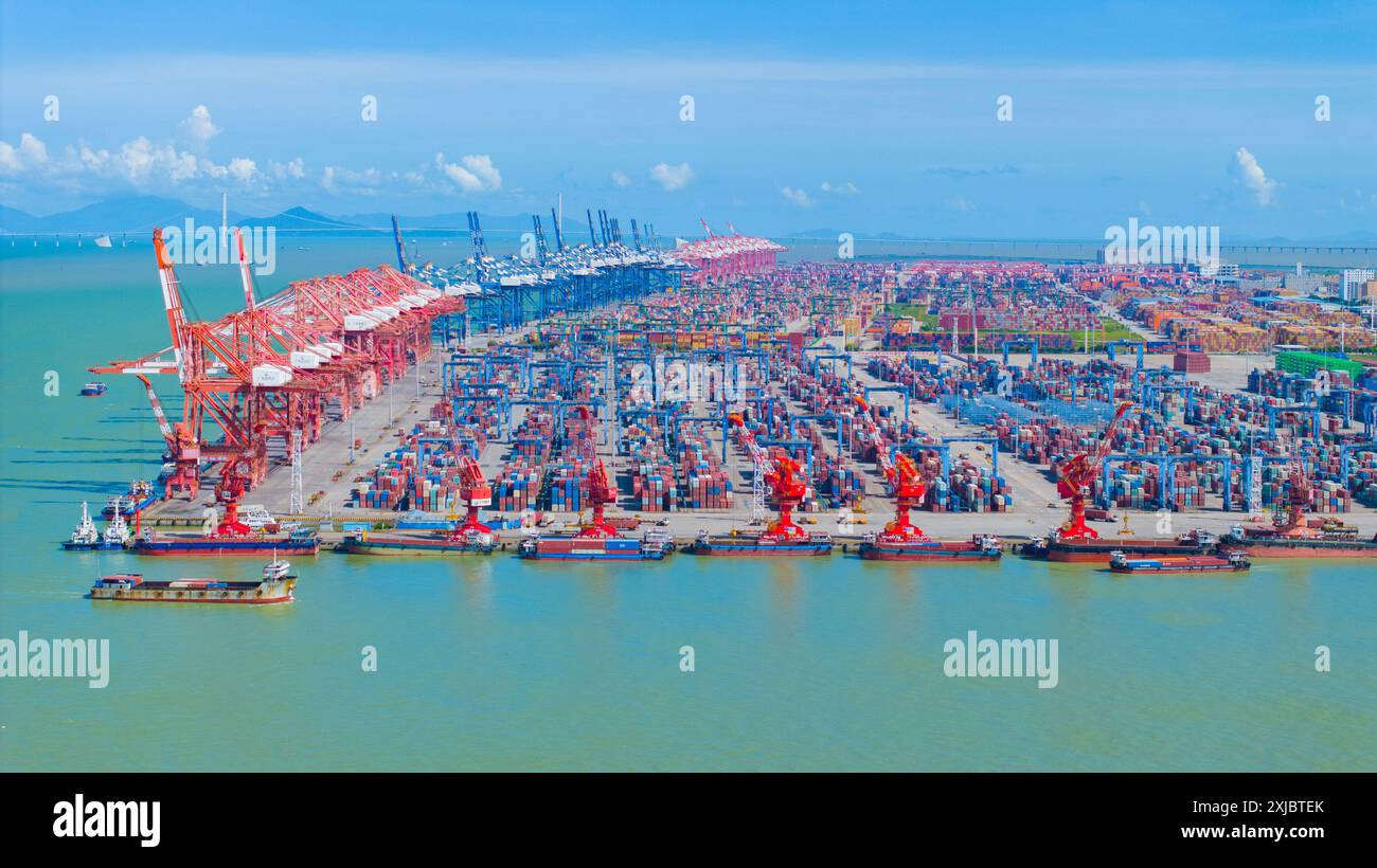 GUANGZHOU, CHINA - JULY 13, 2024 - Cargo ships load and unload cargo at ...