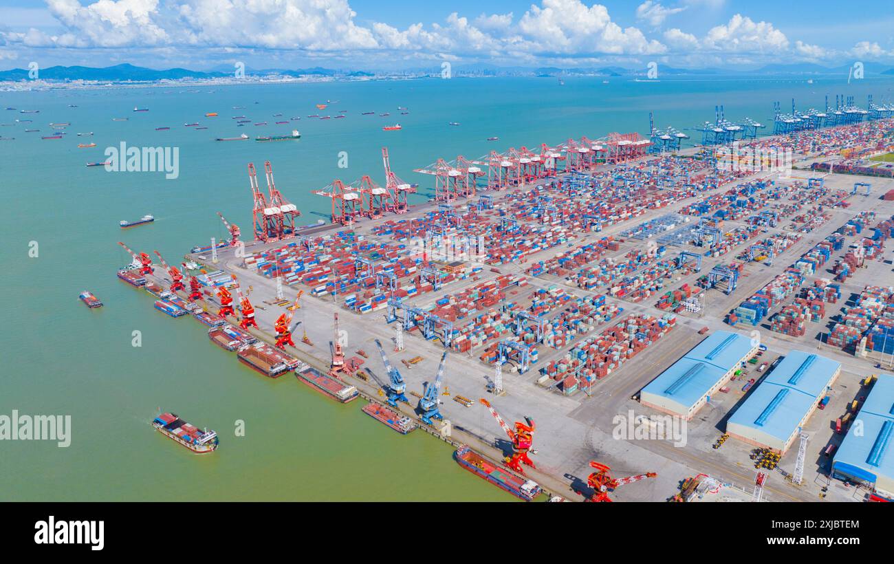 GUANGZHOU, CHINA - JULY 13, 2024 - Cargo ships load and unload cargo at ...