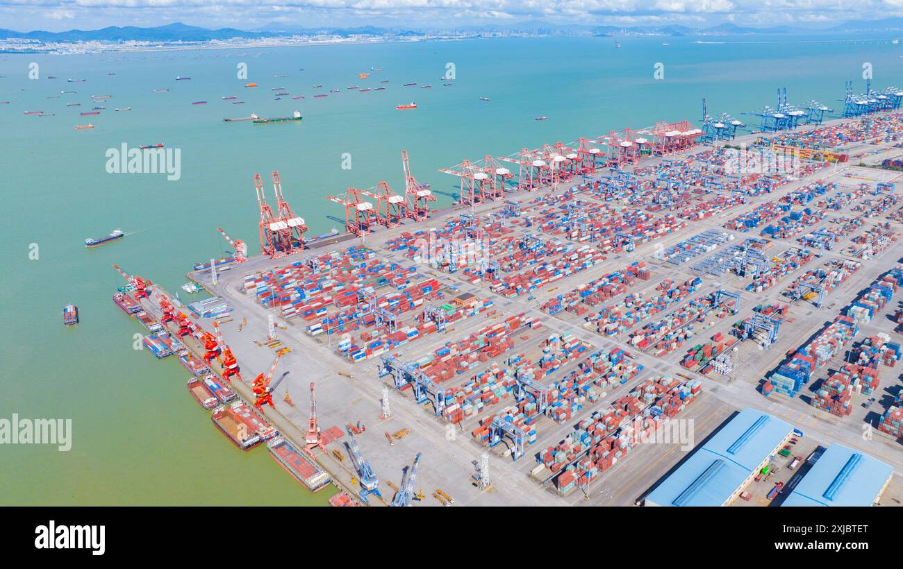 GUANGZHOU, CHINA - JULY 13, 2024 - Cargo ships load and unload cargo at ...