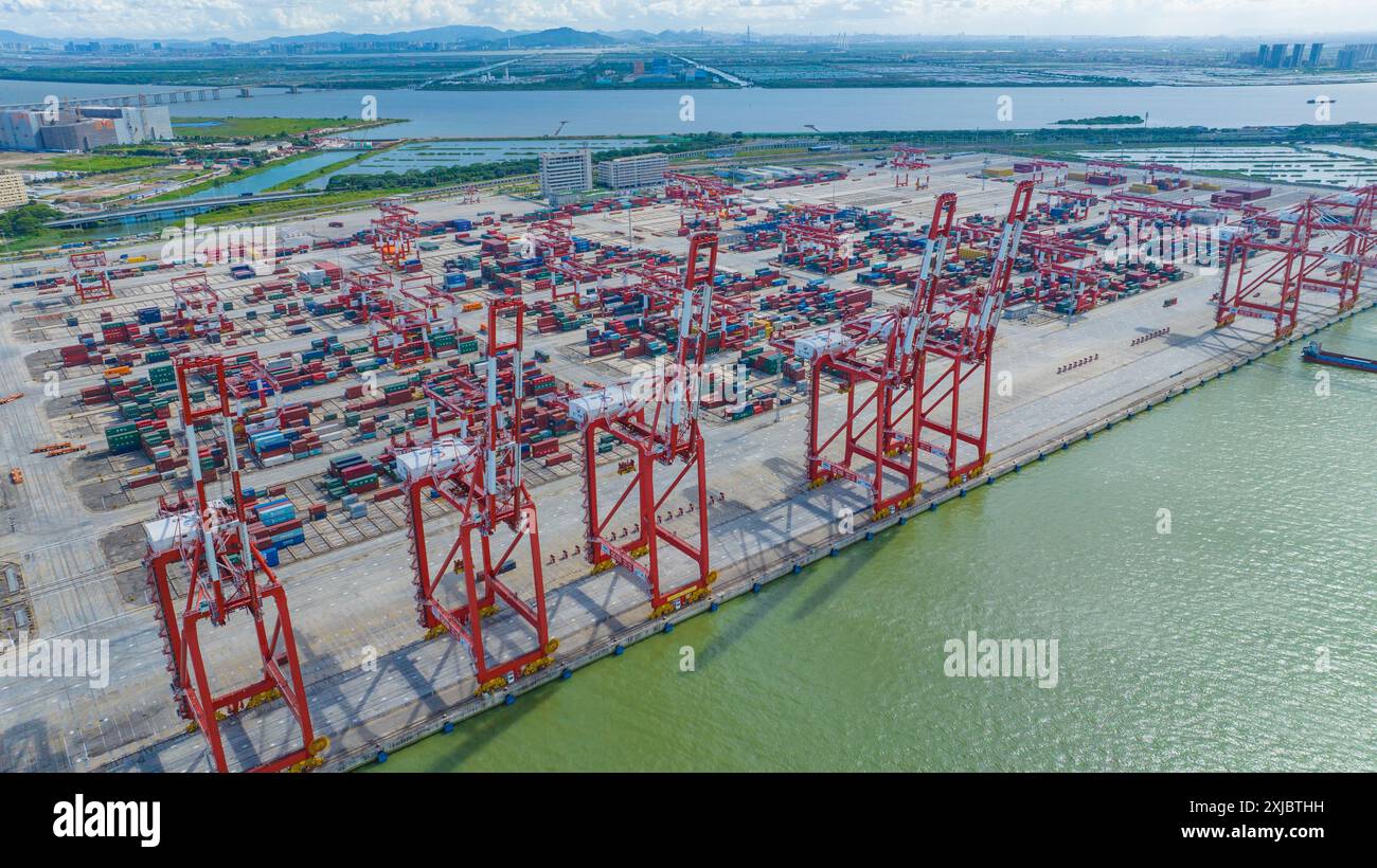 GUANGZHOU, CHINA - JULY 13, 2024 - Cargo ships load and unload cargo at ...