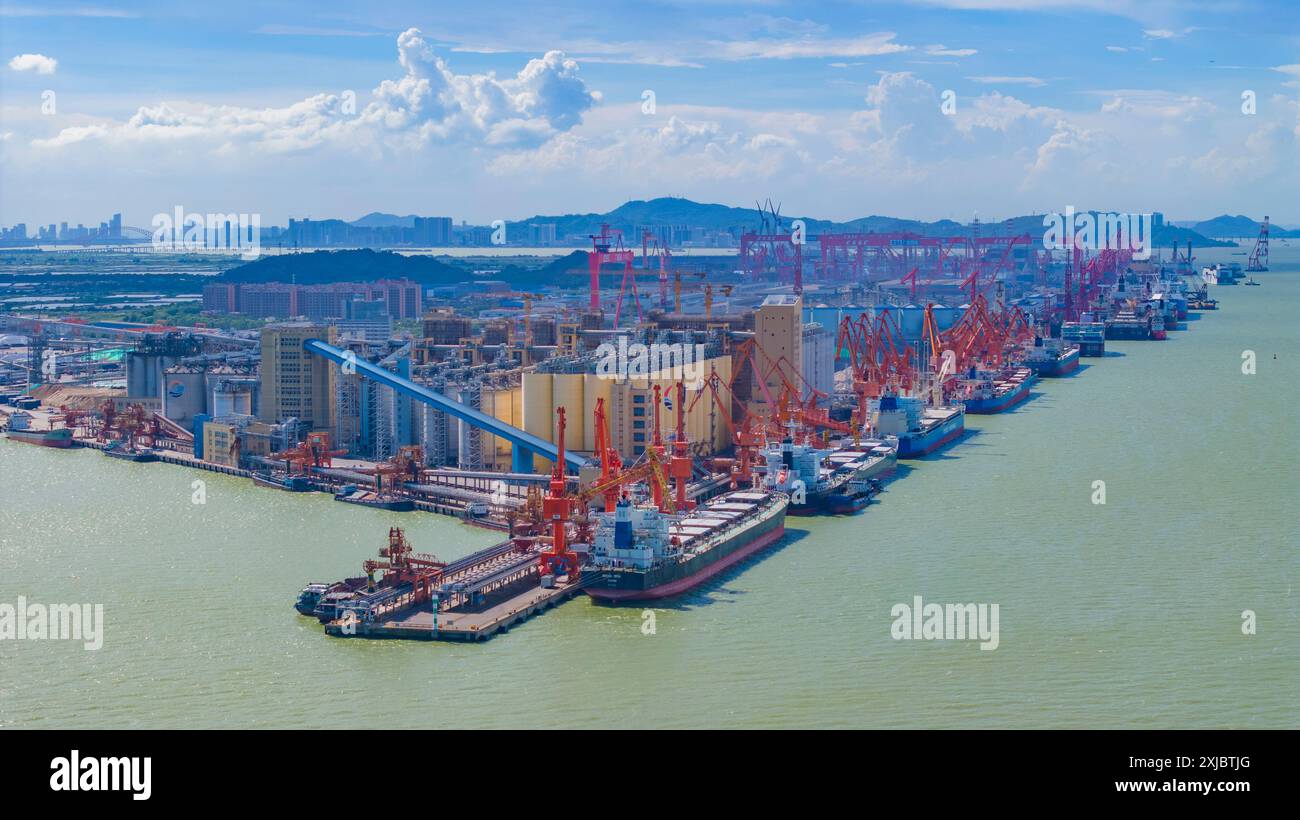 GUANGZHOU, CHINA - JULY 13, 2024 - Cargo ships load and unload cargo at ...