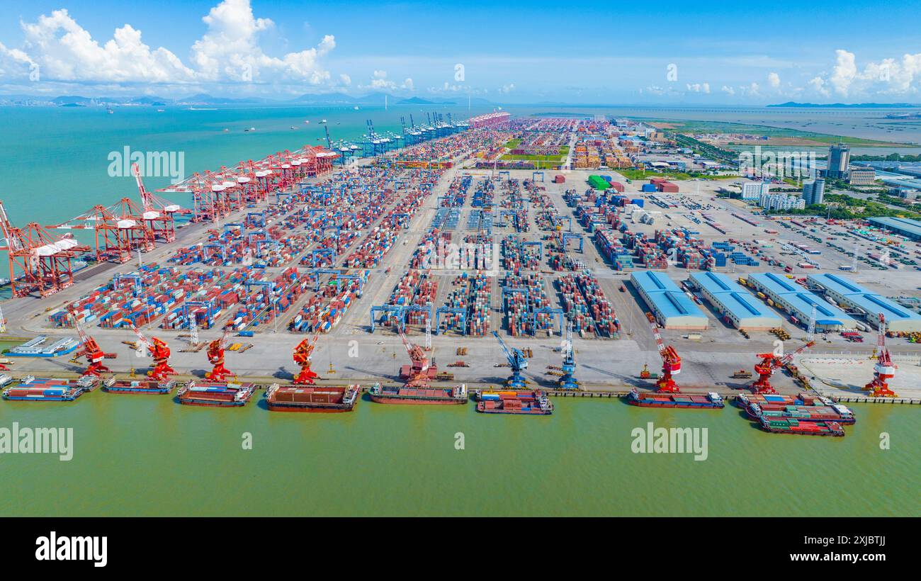GUANGZHOU, CHINA - JULY 13, 2024 - Cargo ships load and unload cargo at ...