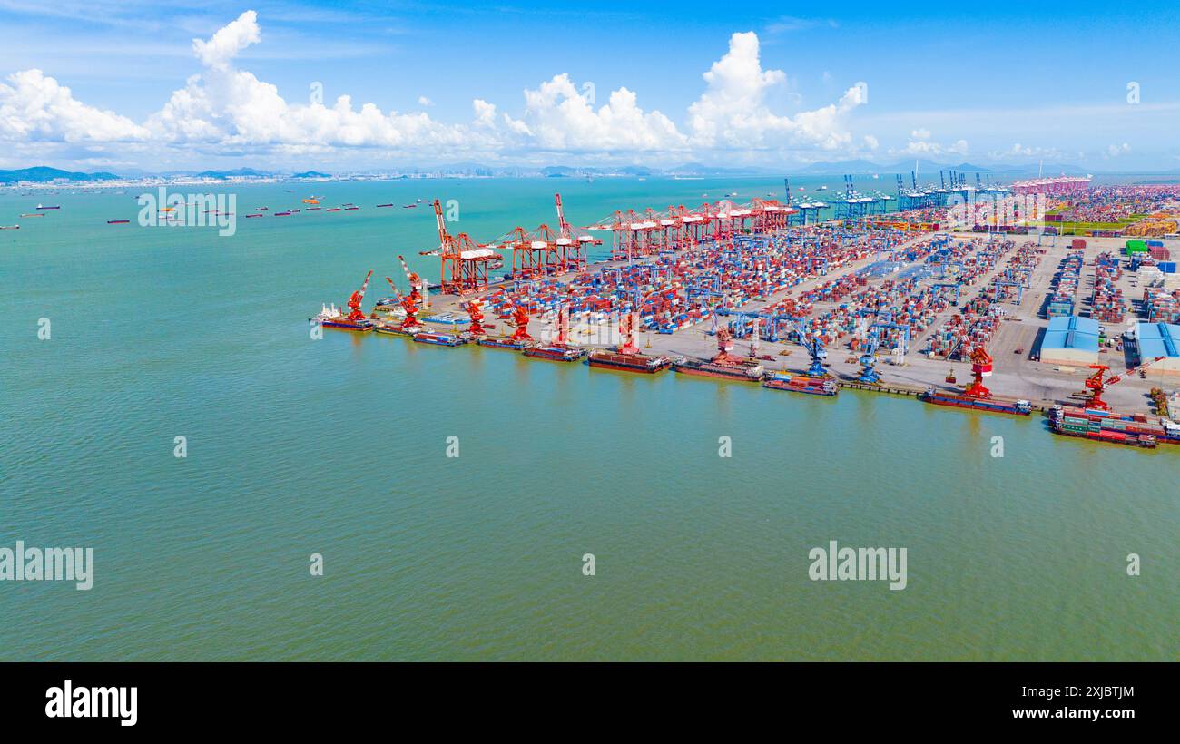 GUANGZHOU, CHINA - JULY 13, 2024 - Cargo ships load and unload cargo at ...