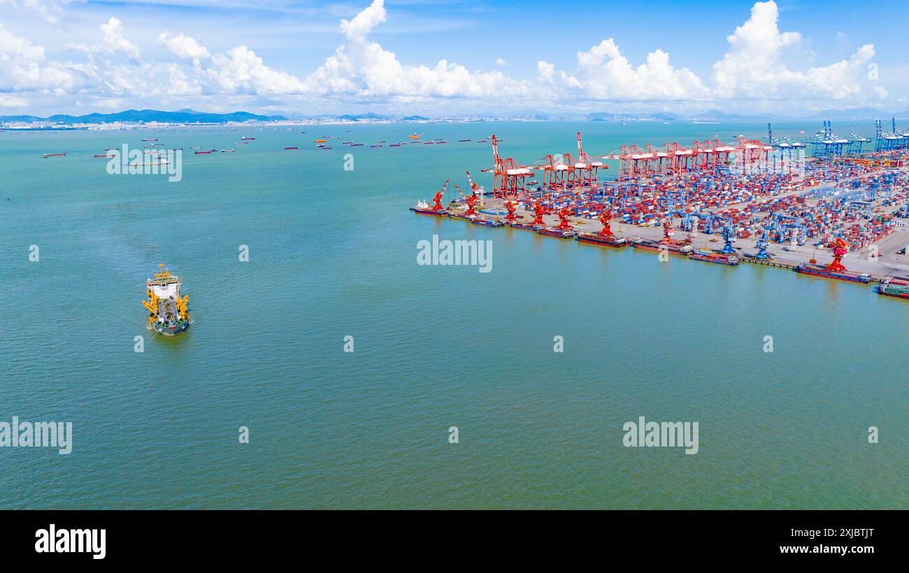 GUANGZHOU, CHINA - JULY 13, 2024 - Cargo ships load and unload cargo at ...