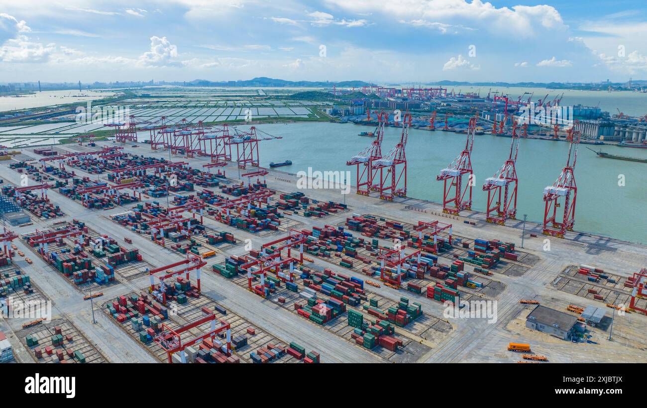GUANGZHOU, CHINA - JULY 13, 2024 - Cargo ships load and unload cargo at ...