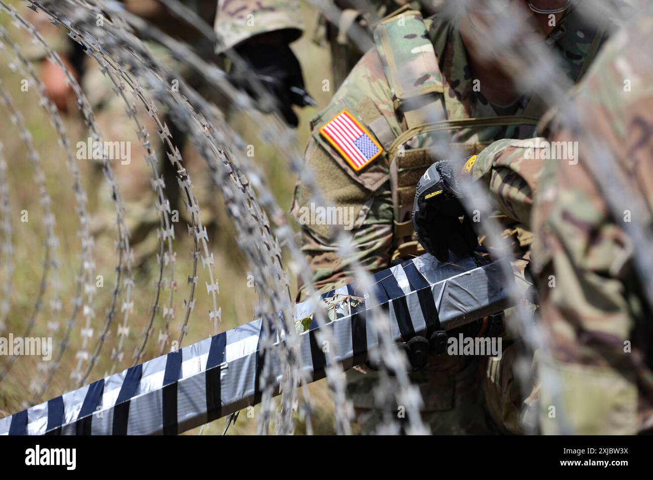 Soldiers assigned to the 1014th Engineer Company, 130th Engineer ...
