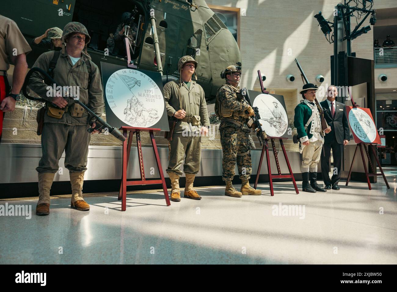 U.S. Marine reenactors pose for a photo after the U.S. Mint unveiling ...