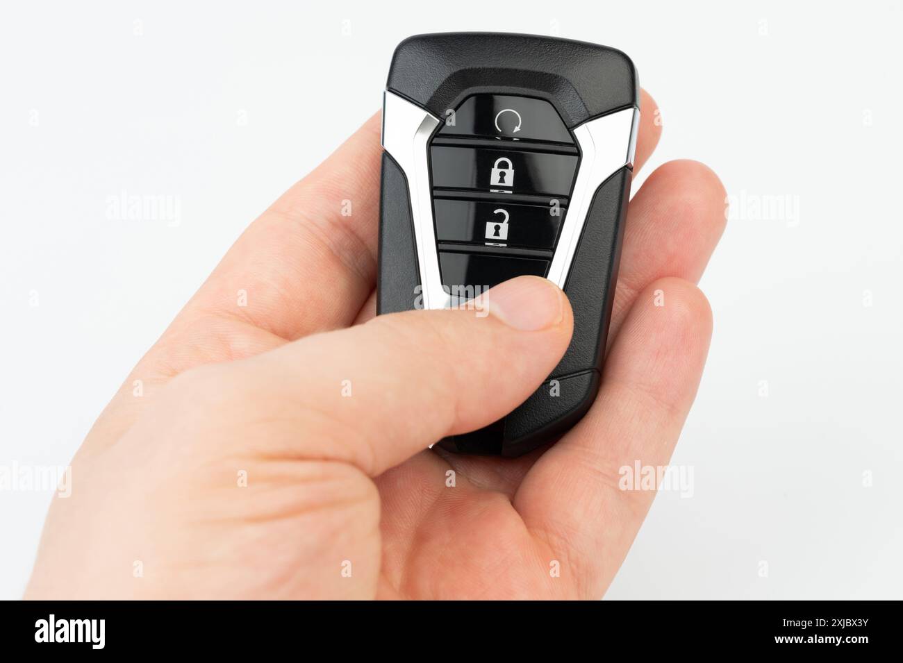 Electronic wireless car key in hand close up view isolated Stock Photo ...