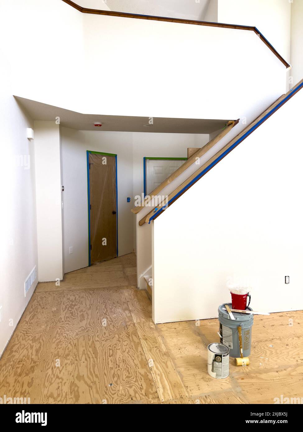 Multi-Level Home Interior Under Renovation with Staircase and Prepped ...