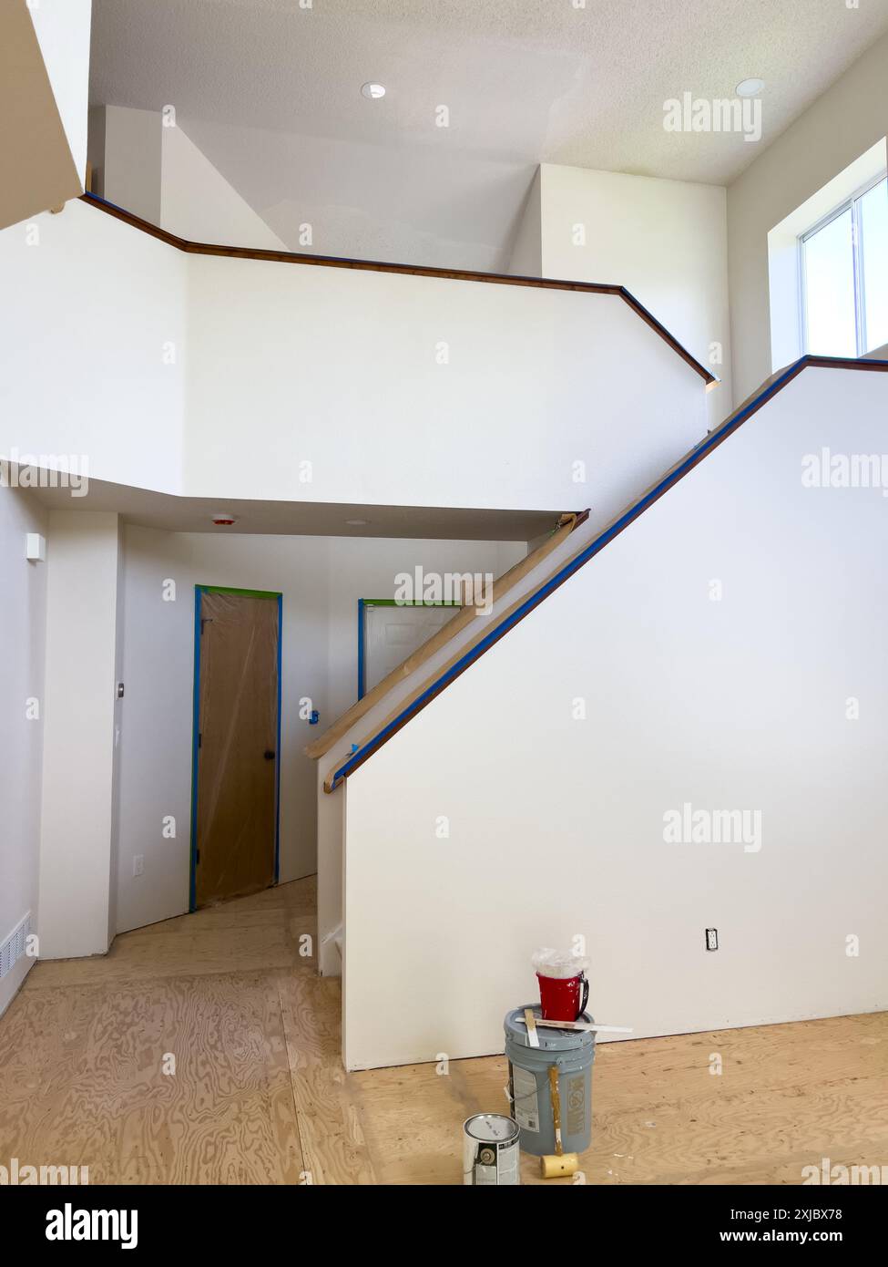 Multi-Level Home Interior Under Renovation with Staircase and Prepped ...