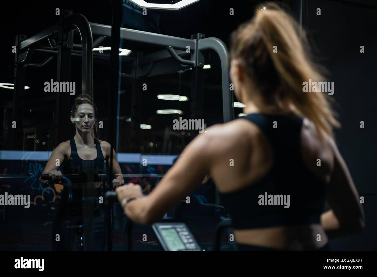Woman uses exercise equipment in hi-res stock photography and images ...