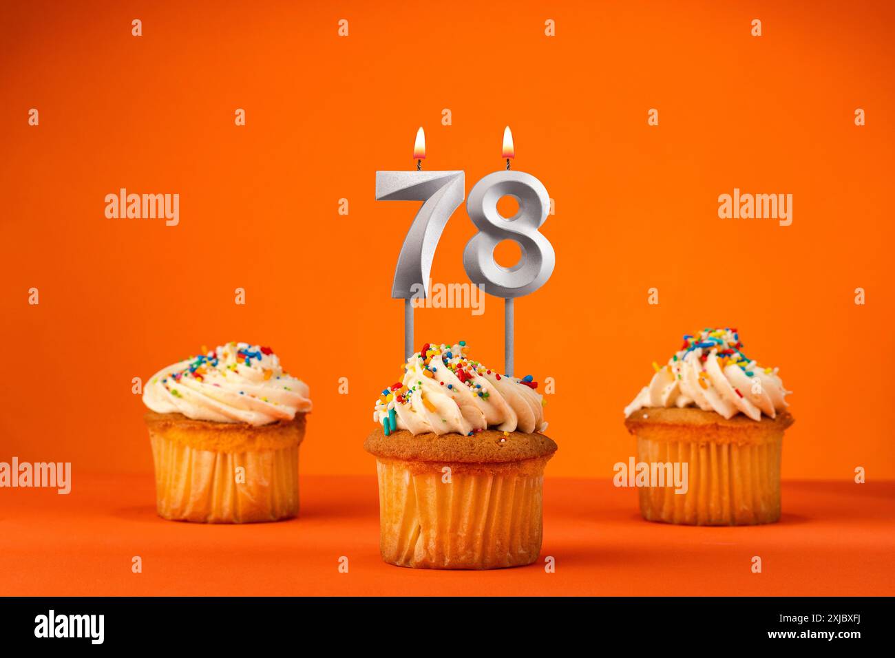 Birthday celebration in orange color - Candle number 78 Stock Photo - Alamy