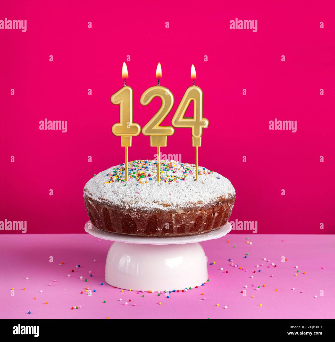 Lighted birthday candle number 124 - Birthday card on pink background ...
