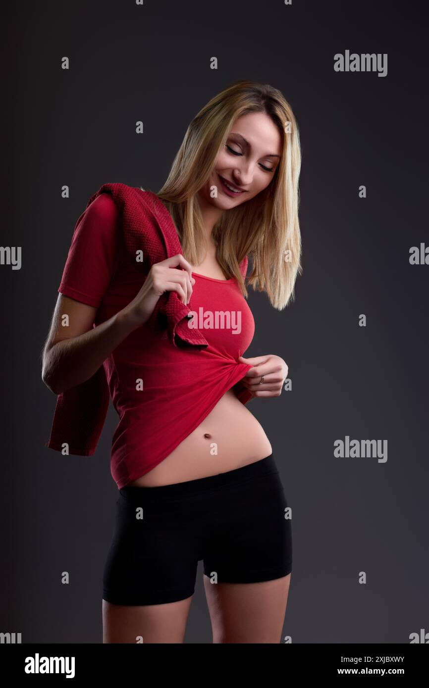 Woman lifting red gray hi-res stock photography and images - Alamy