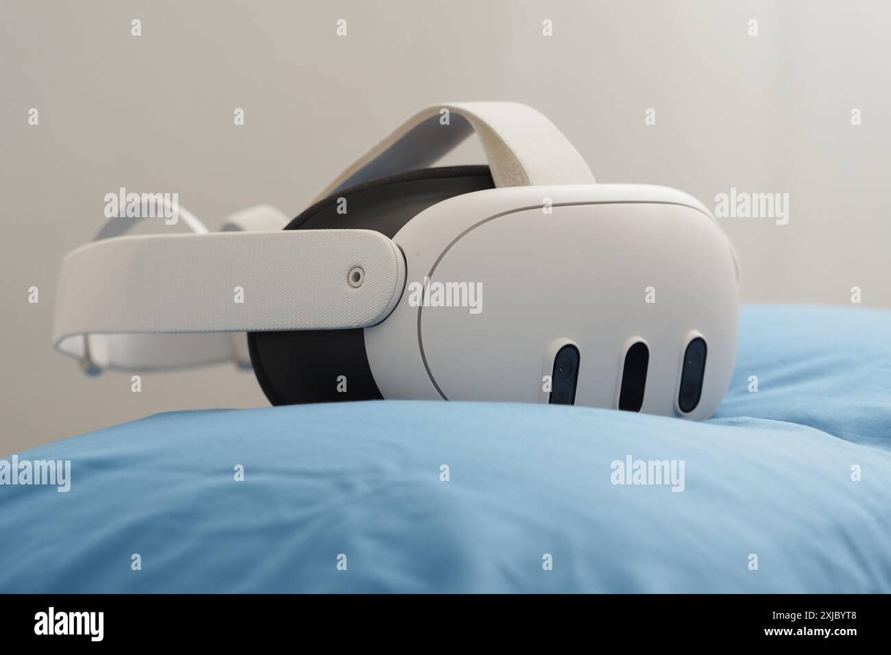 VR headset on pillow. Interacting with Augmented Reality lying on bed ...