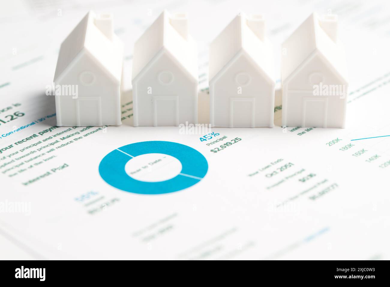 Mortgage loan statement with white house model Stock Photo - Alamy