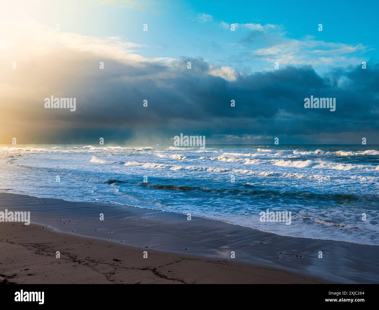 Dramatic beach scene, dawn, dusk light Makorori Beach, New Zealand ...