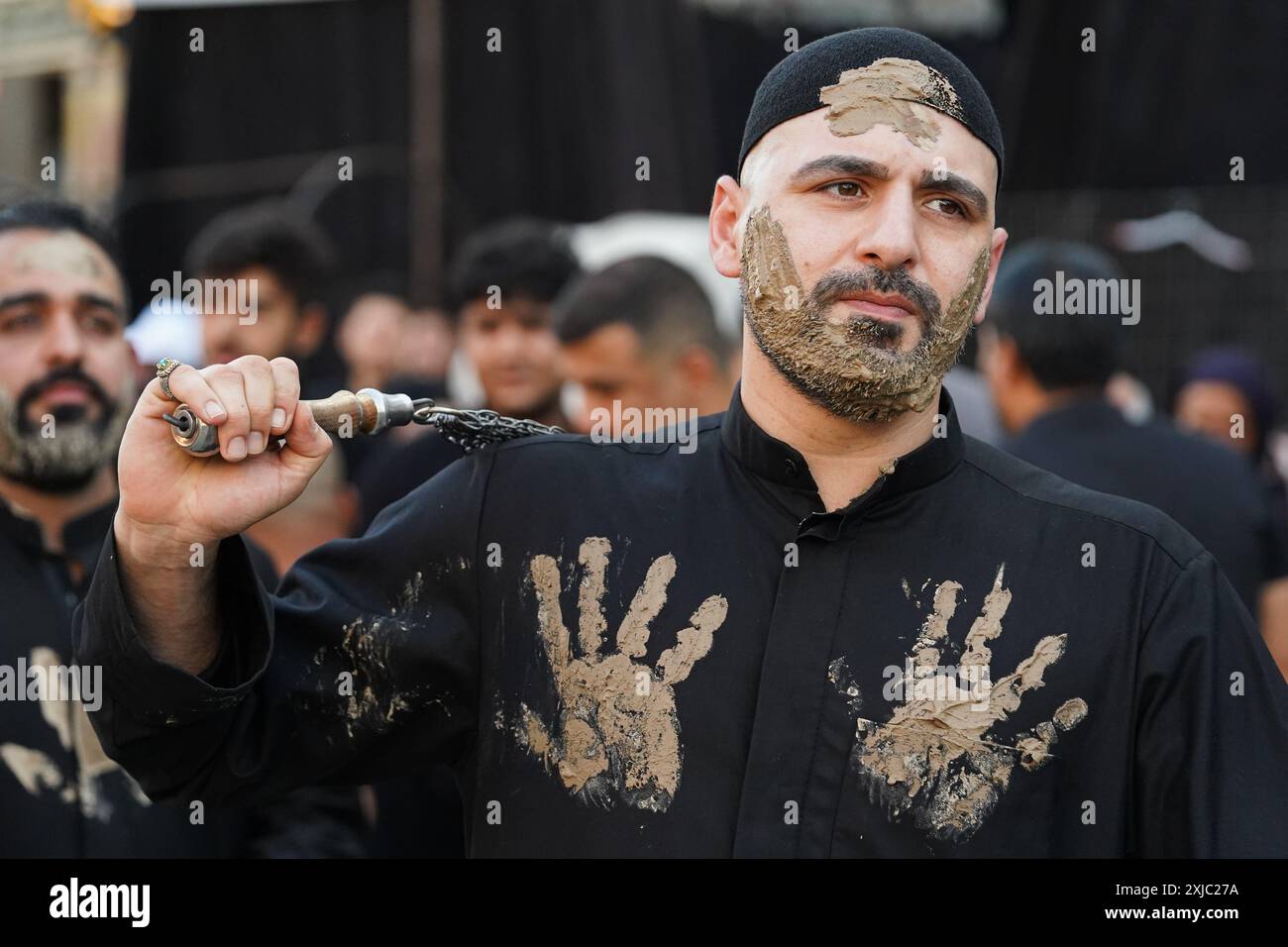 Karbala, Iraq. 16th July, 2024. An Iraqi Shiite Muslim man flogs ...
