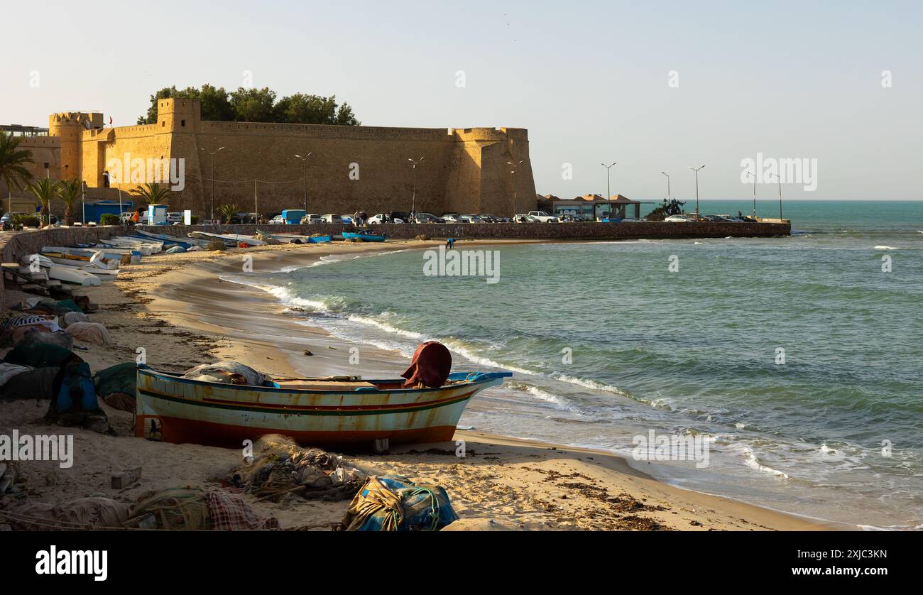 Mediterranean sea and outer stone wall of fort surrounding old medina ...
