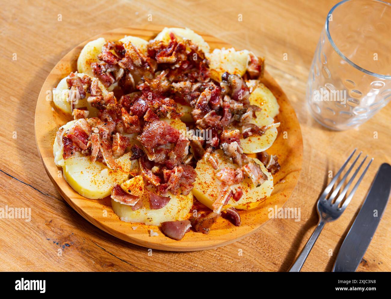 Pieces of pickled and boiled pork ears perfectly complement glass of ...