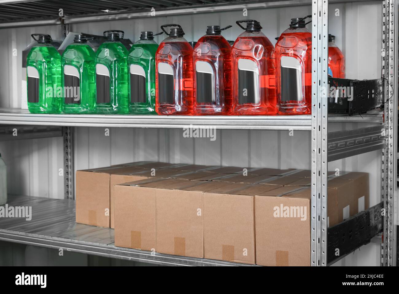 Different car cleaning products and cardboard boxes in auto store Stock ...