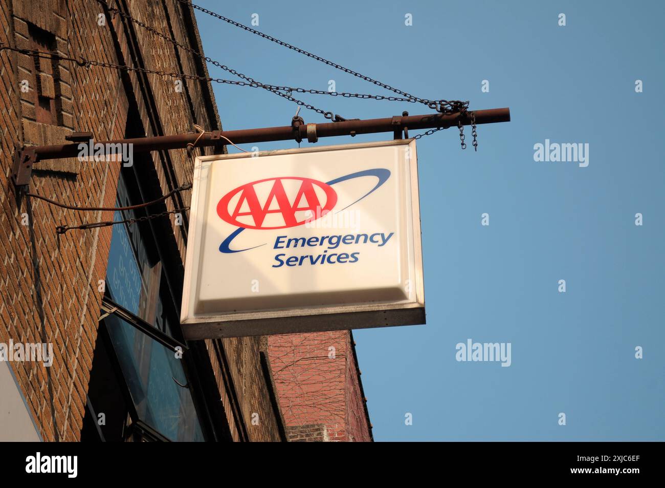 A sign for the American Automobile Association, AAA, is seen at a car ...