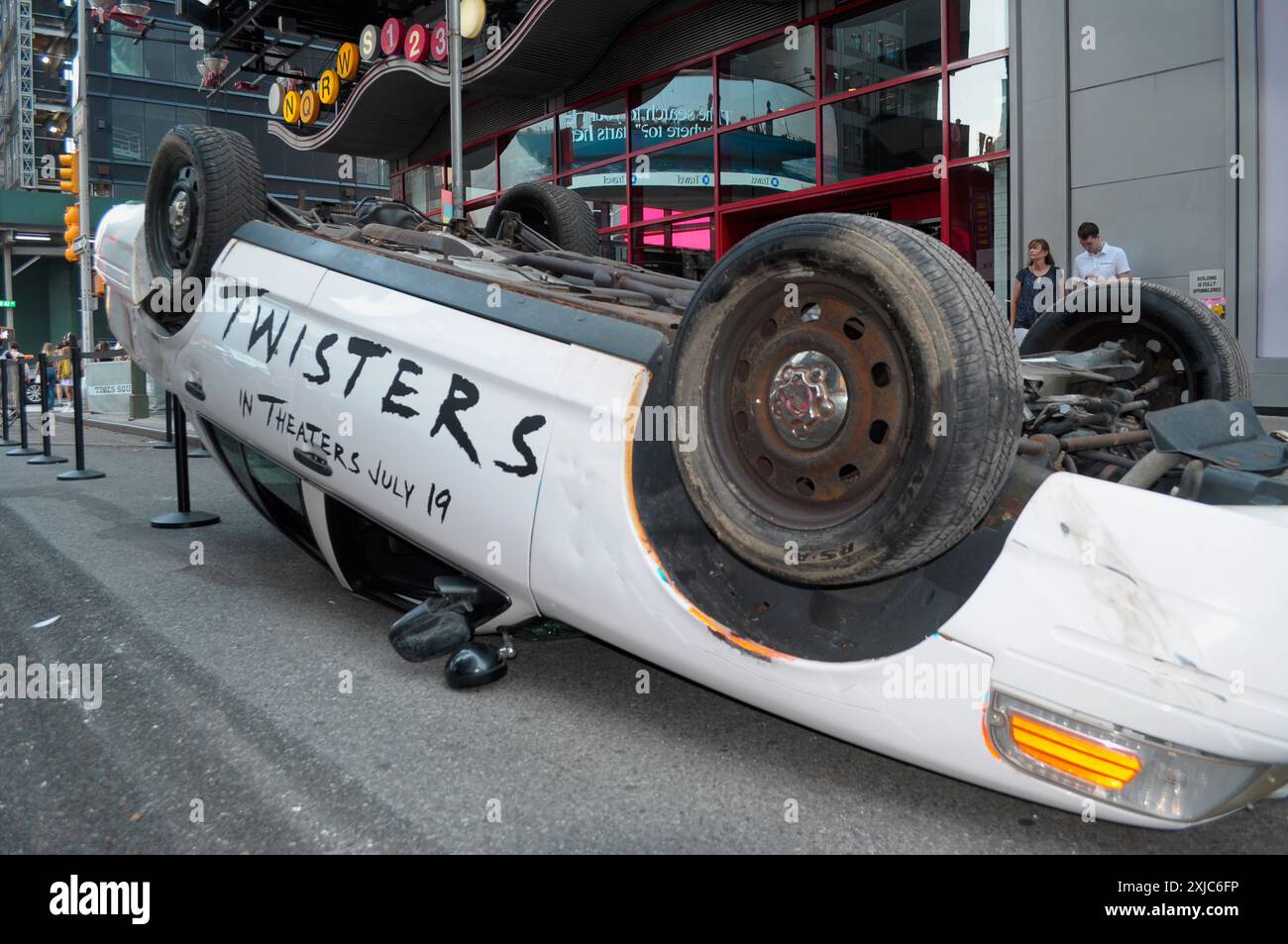 A car flipped upside down serving as an advertisement for the movie ...