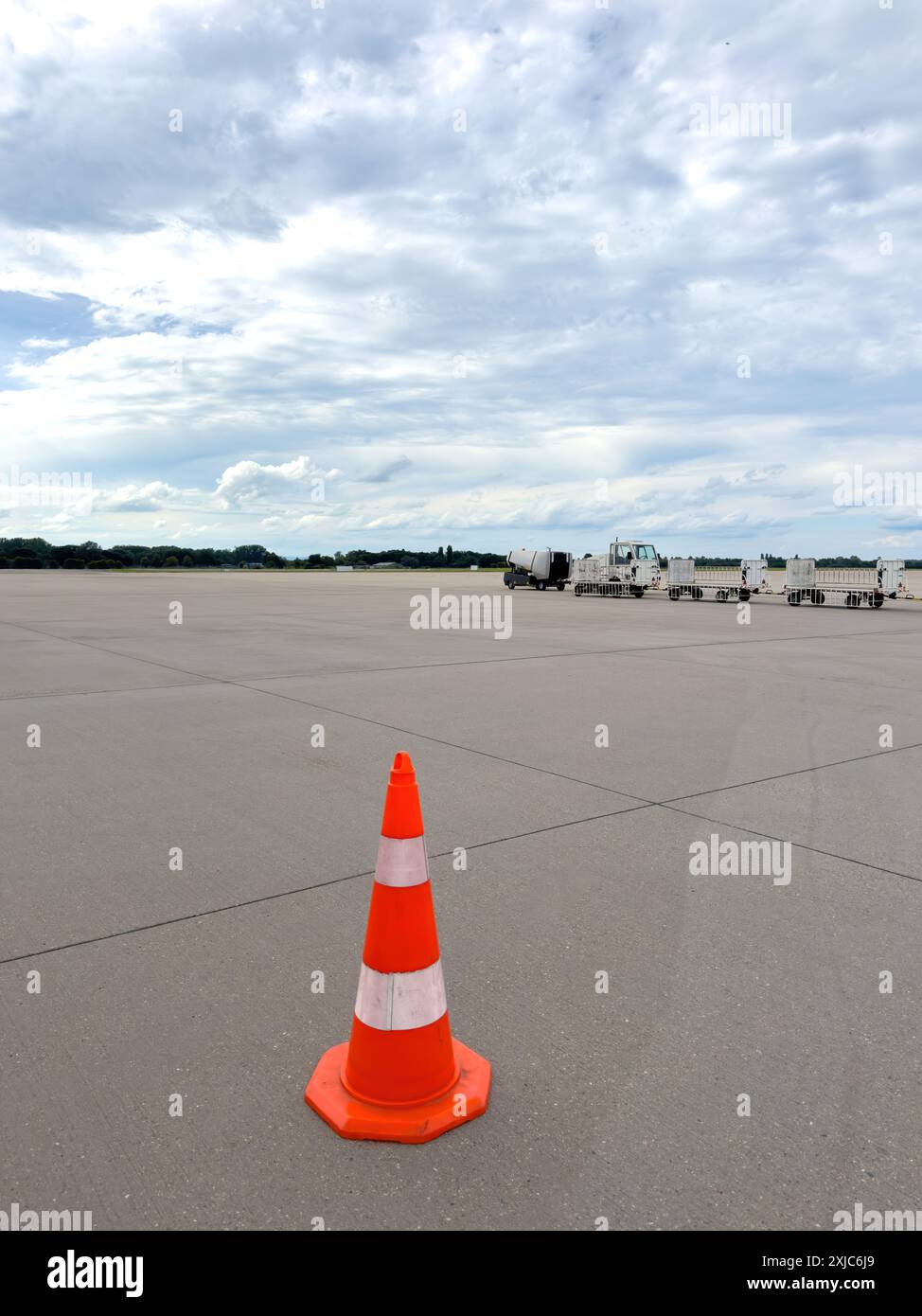 Orange traffic safety cone on a airport runway hi-res stock photography ...