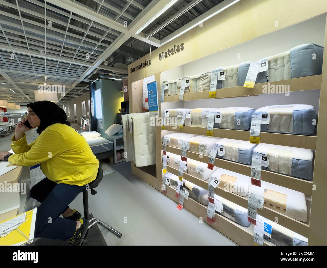 Paris, France - Jul 12, 2024: Middle Eastern ethnicity woman working in ...