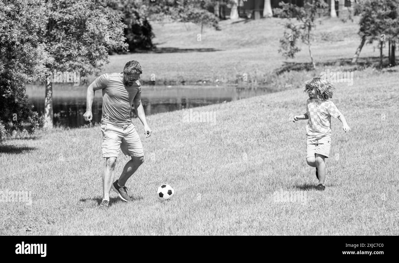 Active father son playing football in summer. Father and child son ...