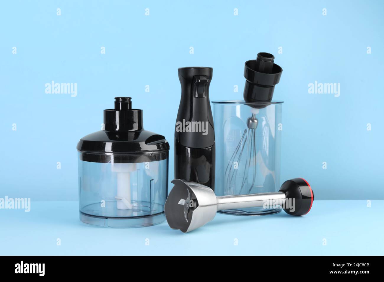 Hand blender kit on light blue background Stock Photo - Alamy