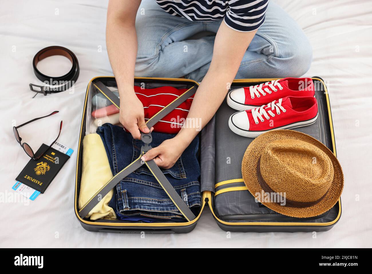 Hand on suitcase bed hi-res stock photography and images - Alamy
