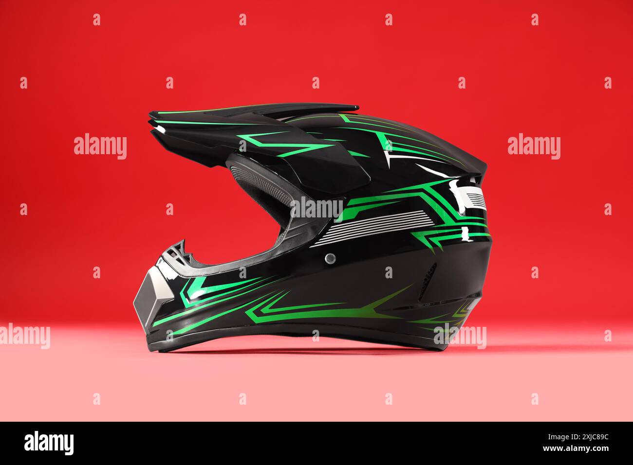Modern motorcycle helmet with visor on red background Stock Photo - Alamy