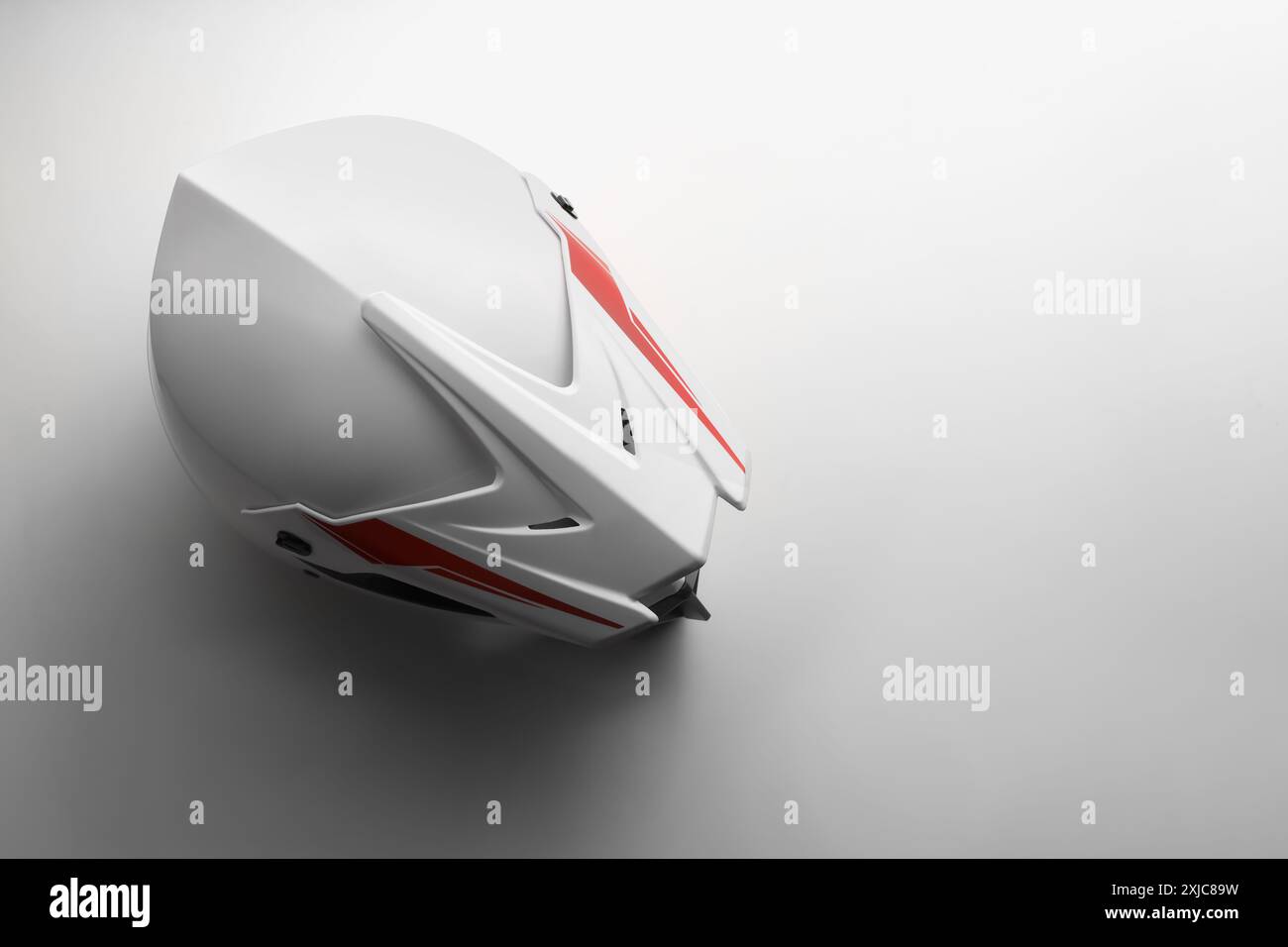 Stylish motorcycle helmet on white background, top view. Space for text ...