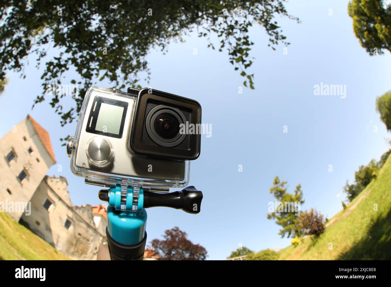 Modern action camera with monopod outdoors. Fisheye lens effect Stock ...