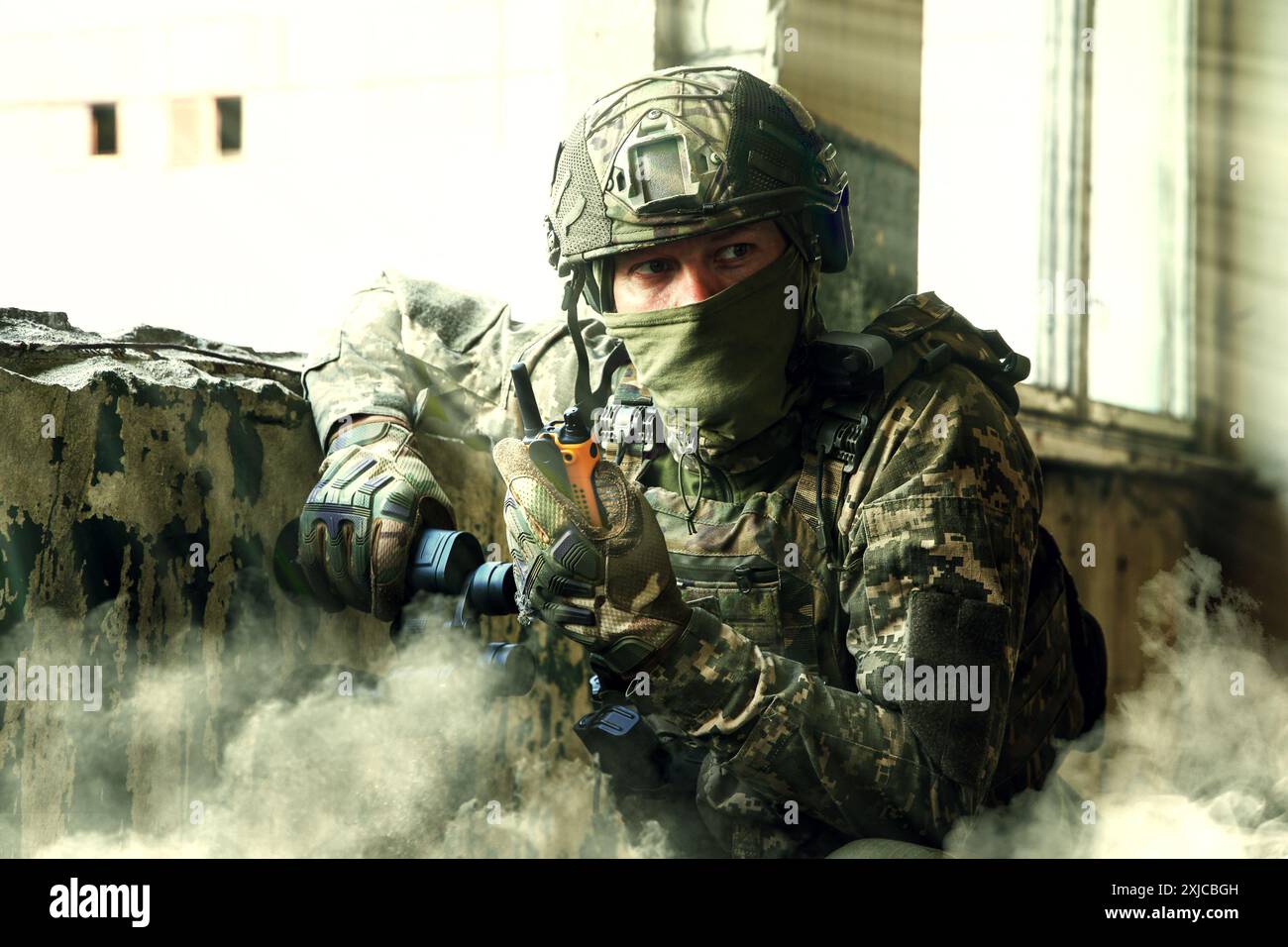 Soldier using radio in building during military operation Stock Photo ...