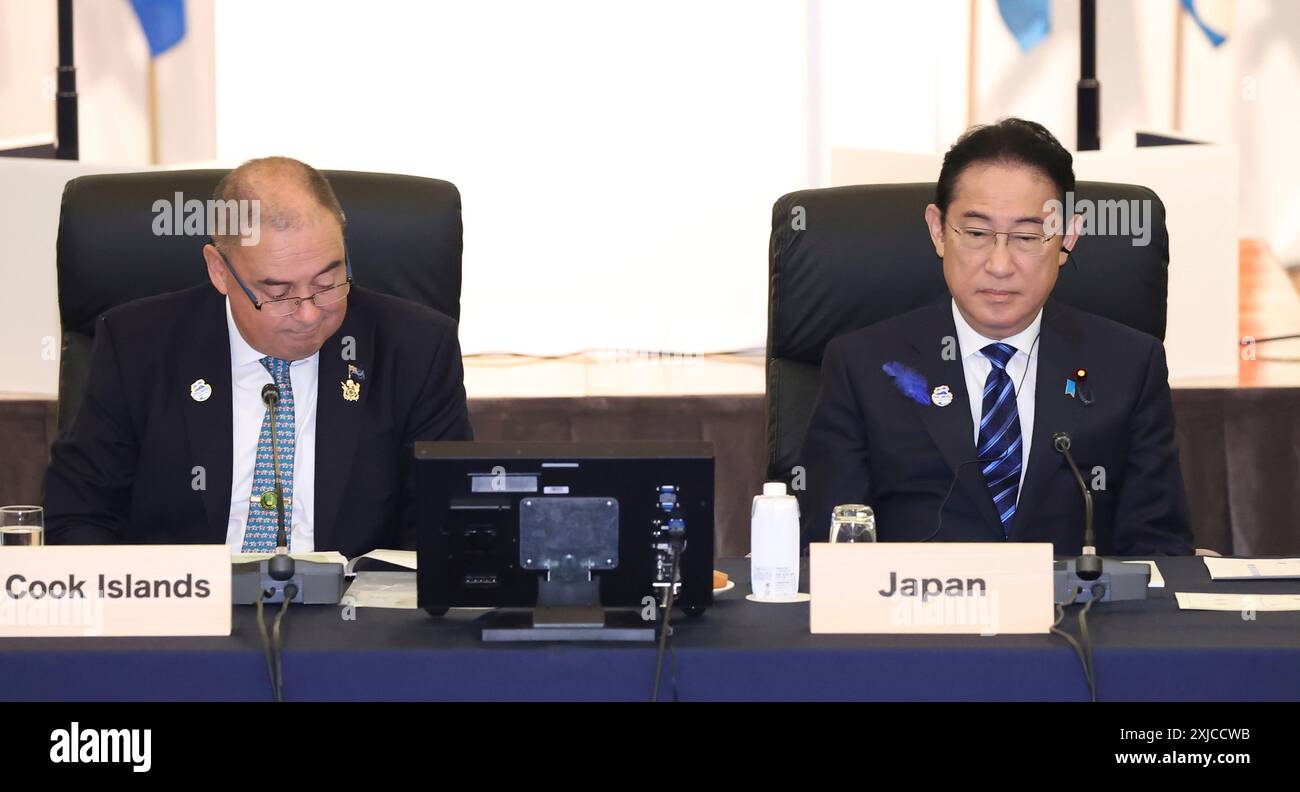 Japanese Prime Minister Fumio Kishida (right) attends an opening ...