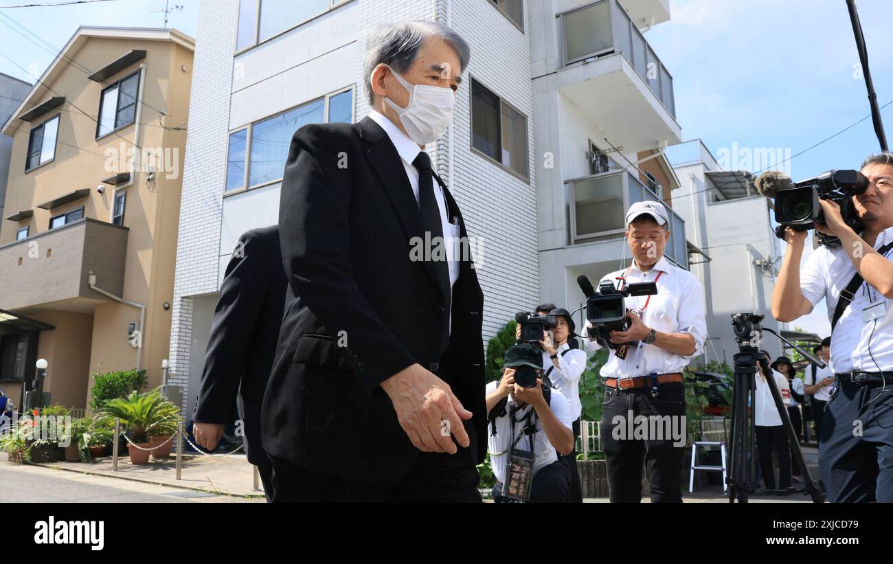 Hideaki Hatta, a president of Kyoto Animation, heads for a venue of a ...